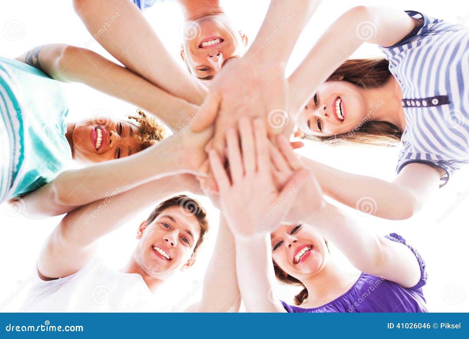 Friends joining hands stock photo. Image of huddle, hands - 41026046