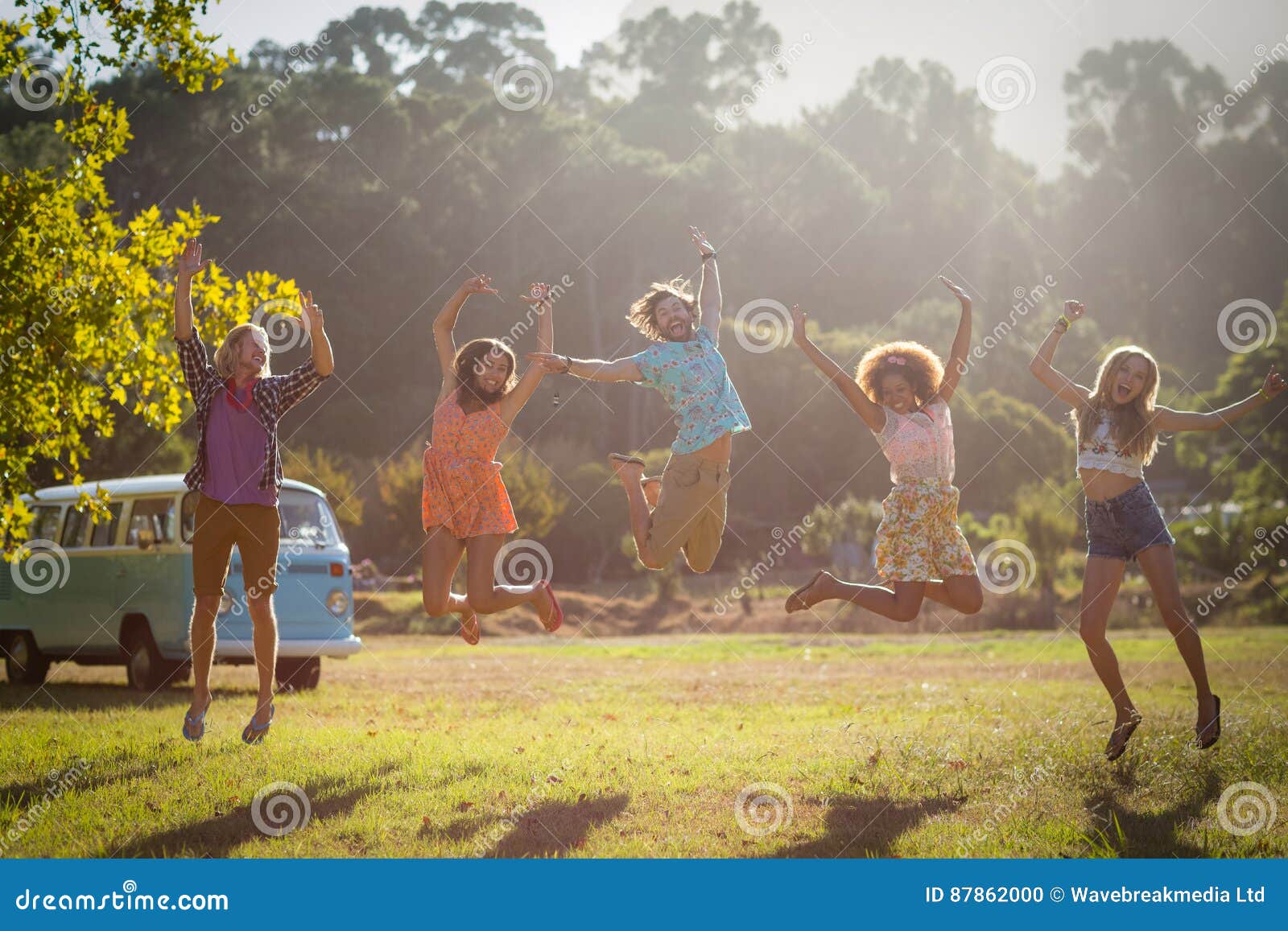 Friends Jumping in Excitement in Park Stock Photo - Image of bonding ...