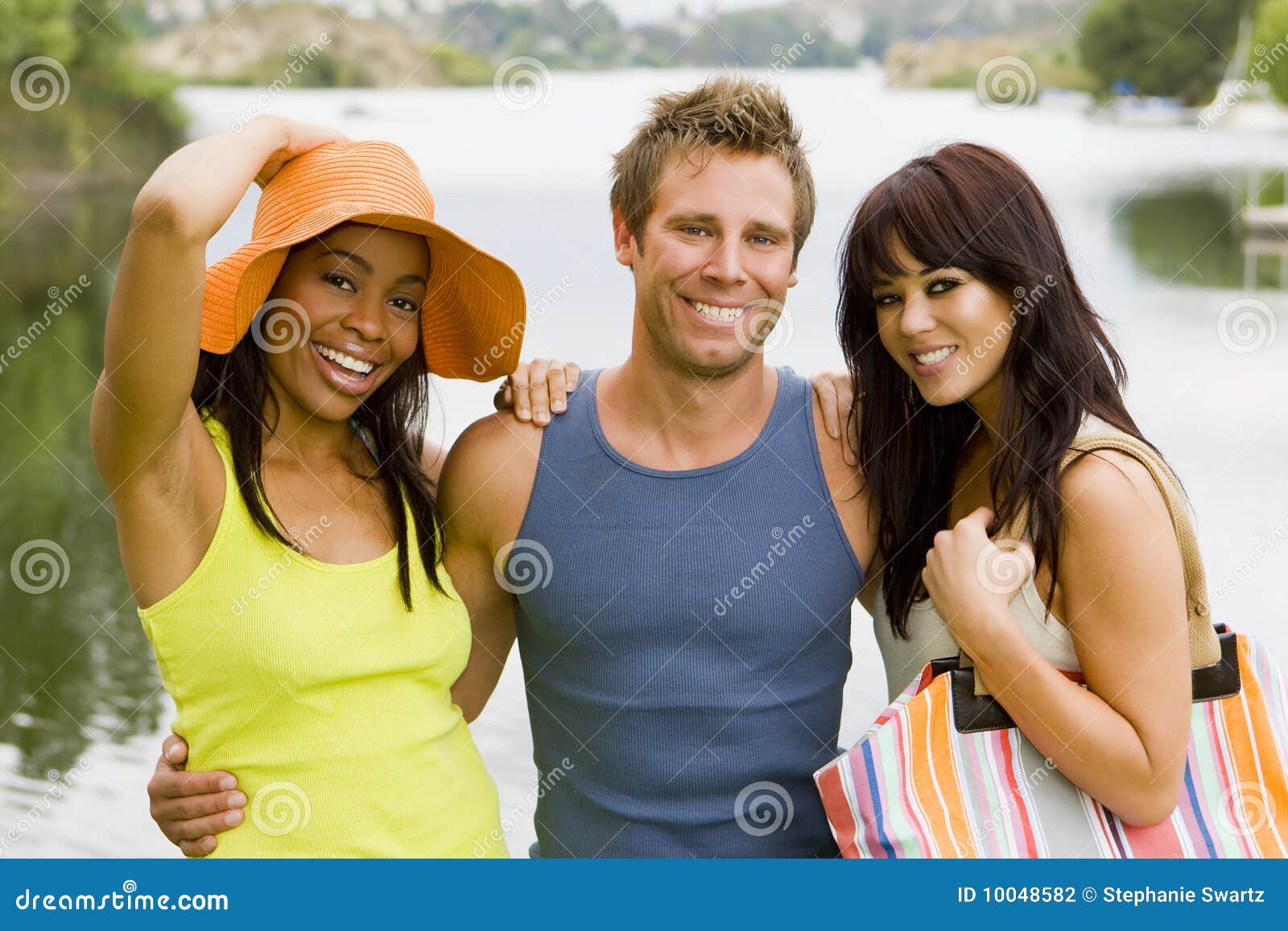 Friends at the lake stock photo. Image of body, bikini - 10048582