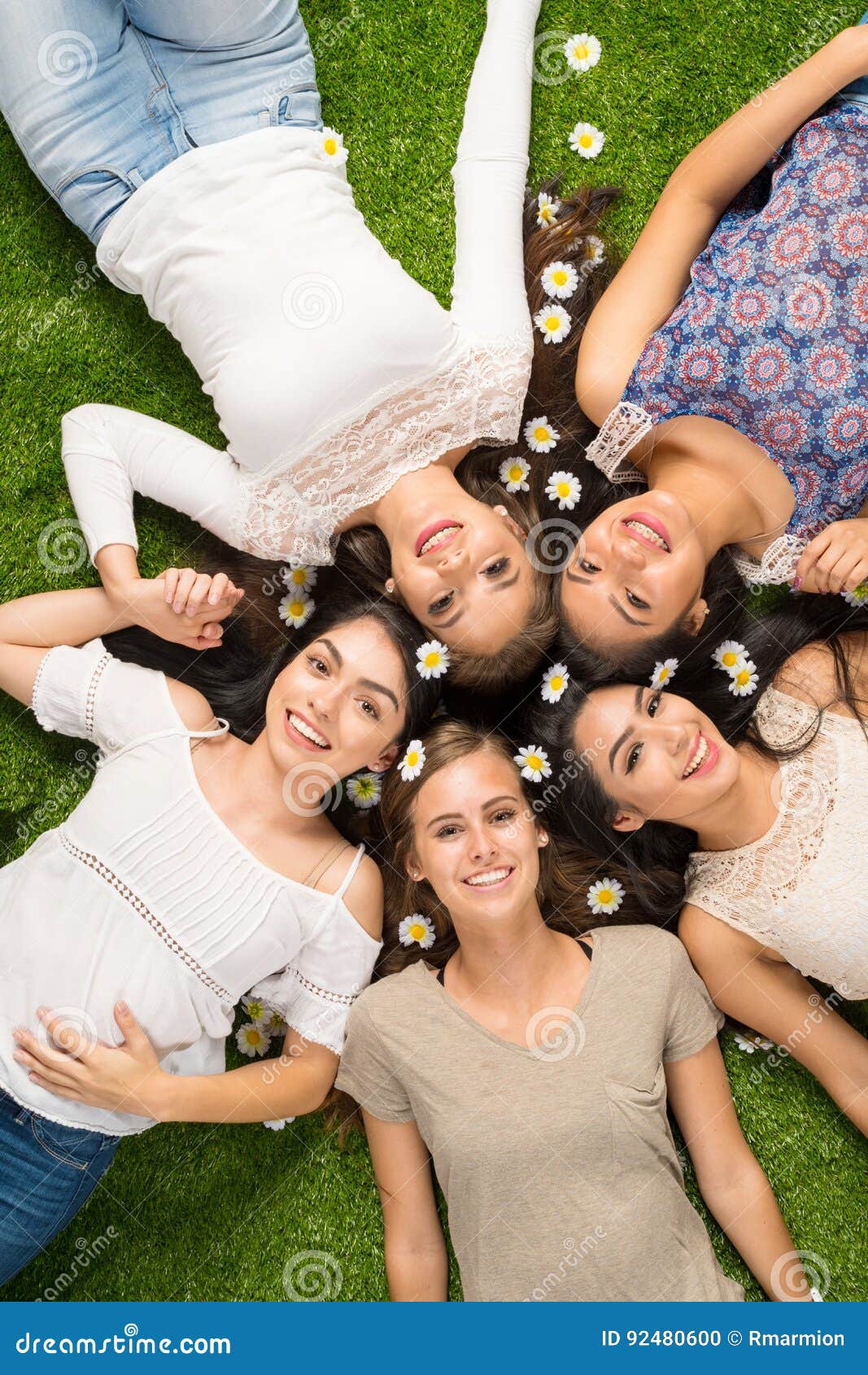 Friends Laying in the Grass Stock Photo - Image of teenage, family ...