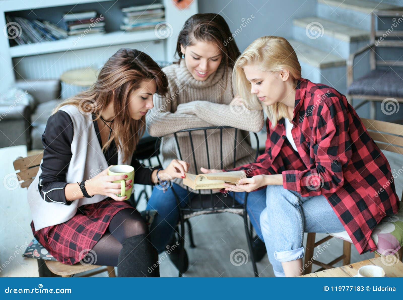 Students Learning in a Cafe. Stock Image - Image of group, girl: 119777183