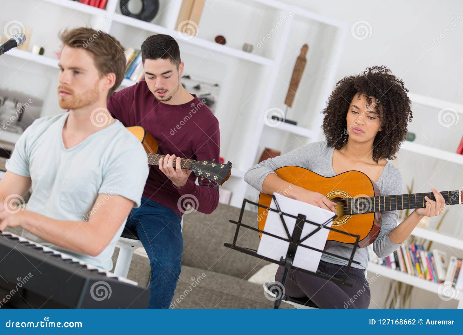 Friends Learning To Play Music Instrument Stock Photo - Image of people ...