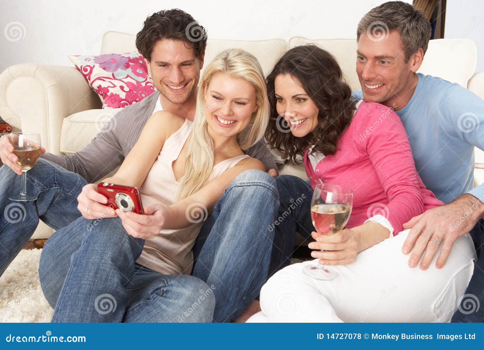Friends Looking at Pictures on Digital Camera Stock Photo - Image of ...
