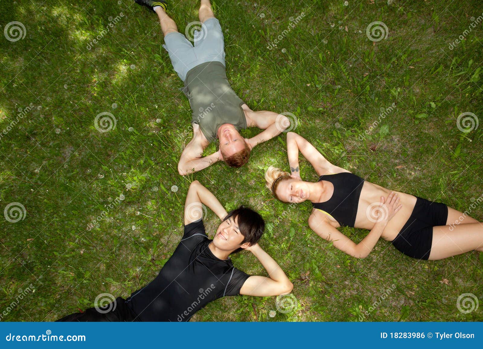 Friends Lying and Resting on Ground Stock Photo - Image of rest, casual ...
