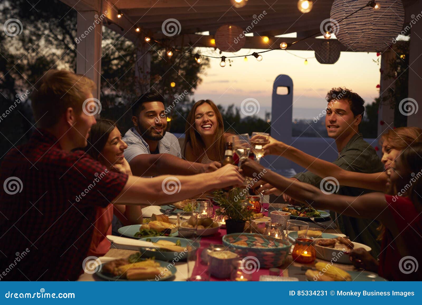 Friends Make a Toast at a Dinner Party on a Patio, Close Up Stock Image ...