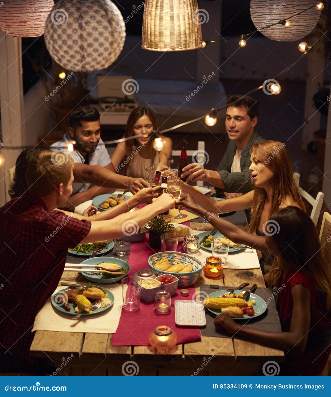 Friends Making a Toast at a Patio Dinner Party, Vertical Stock Image ...