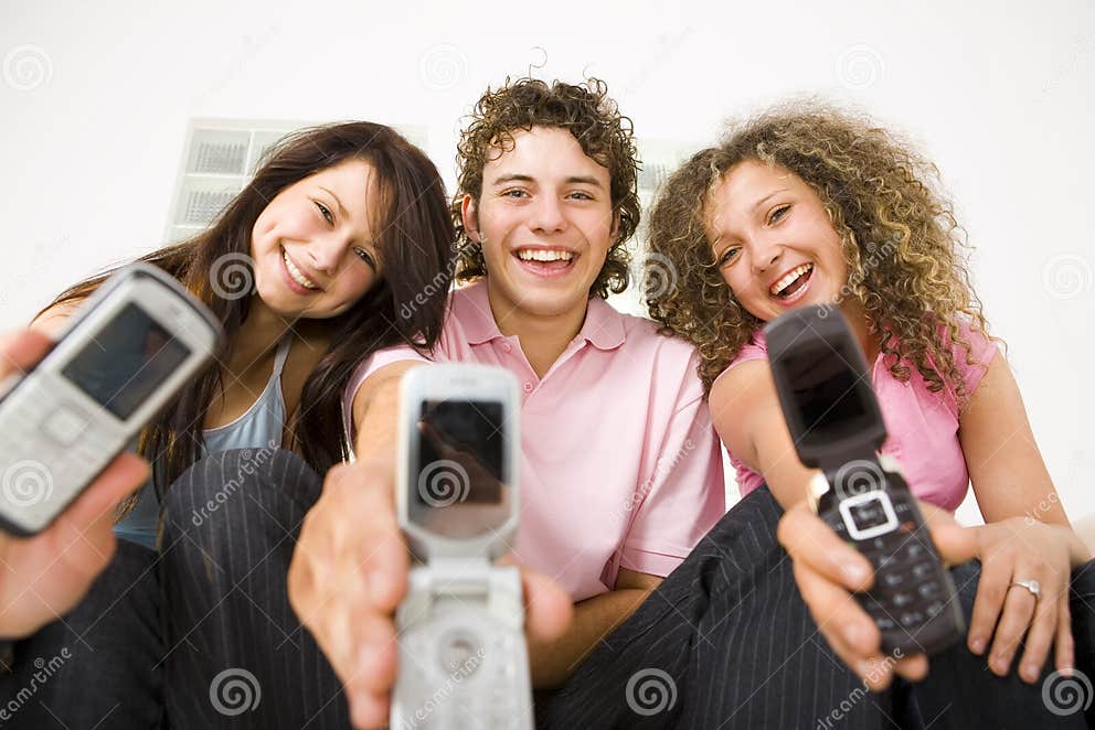Friends with mobile phones stock photo. Image of college - 5407844