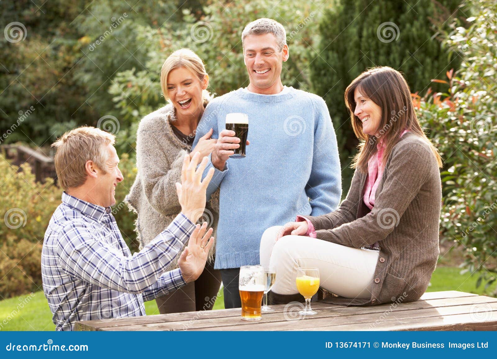 Friends Outdoors Enjoying Drink in Pub Garden Stock Image - Image of ...