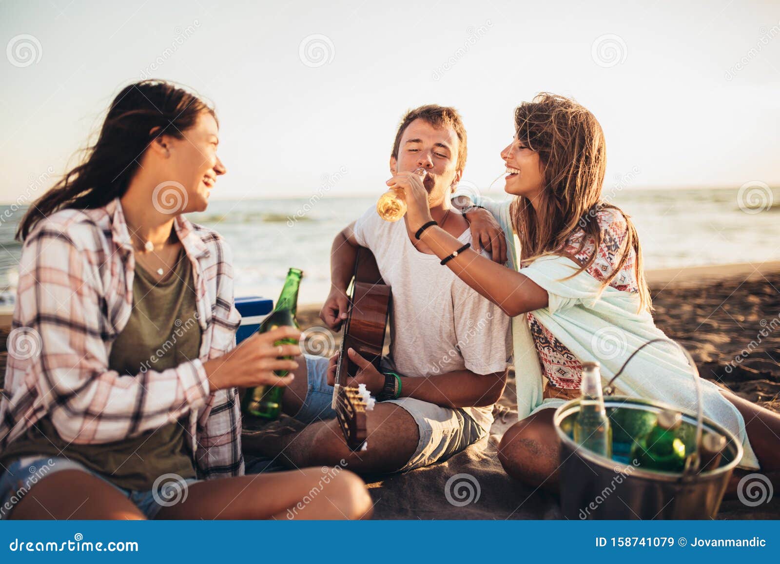 Friends Partying on the Beach with Drinks Stock Image - Image of party ...