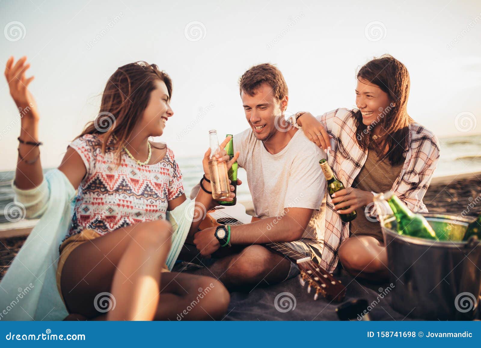 Friends Partying on the Beach with Drinks Stock Photo - Image of ...