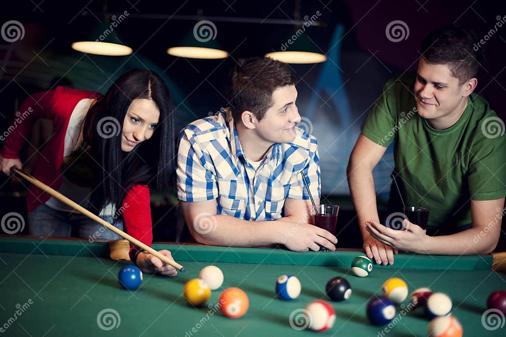 Friends playing billiard stock photo. Image of bending - 29192604