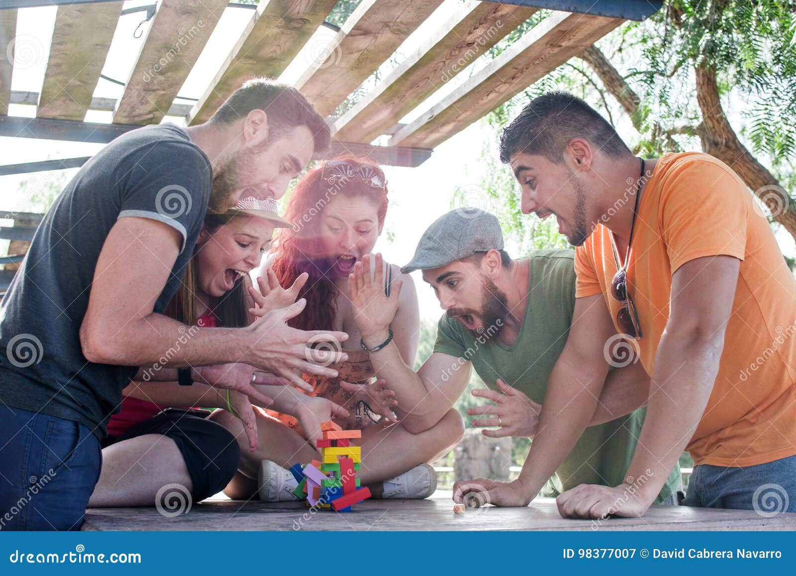 Friends playing block game stock image. Image of holiday - 98377007