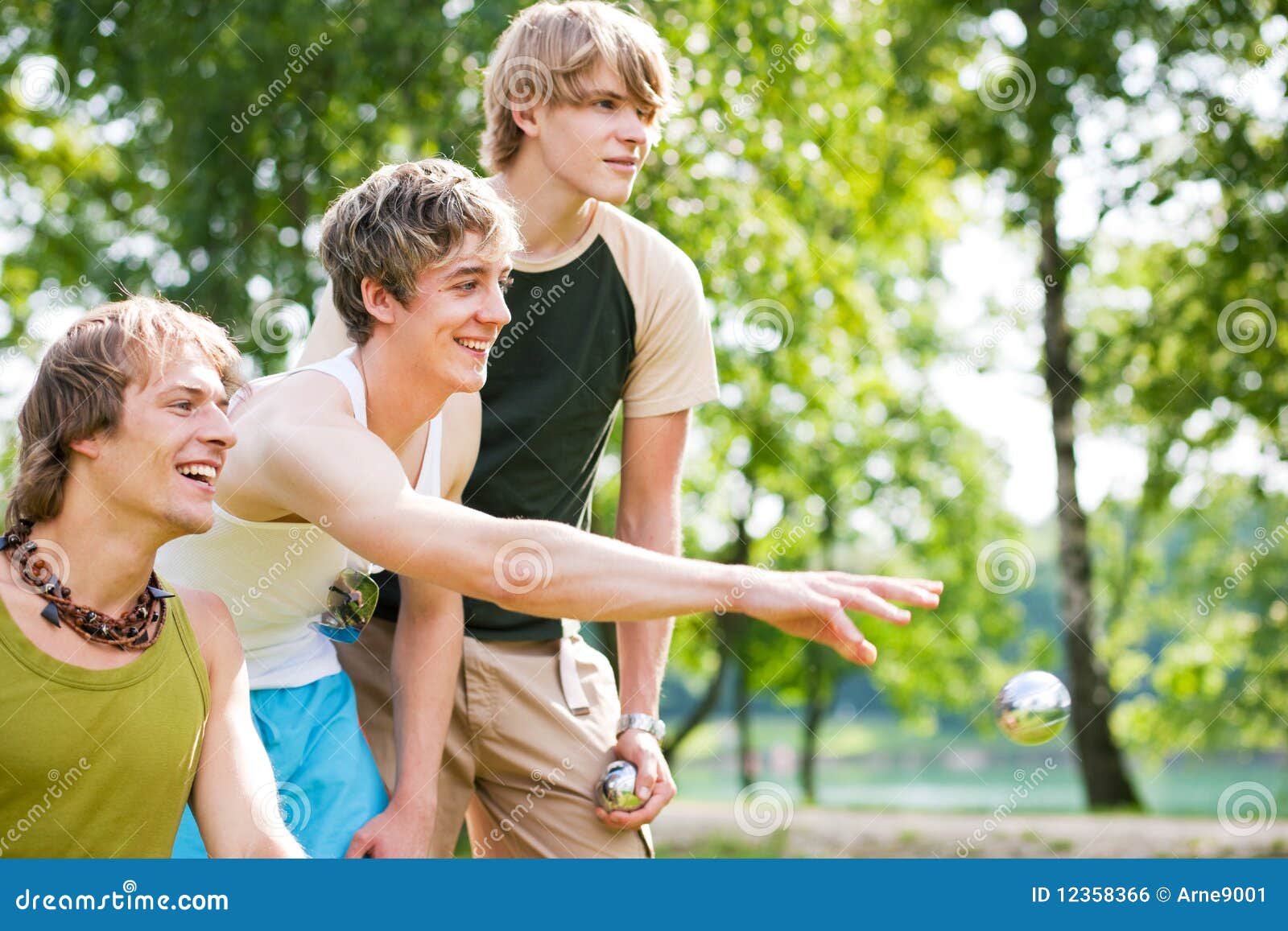 Friends playing boule stock photo. Image of meadow, group - 12358366