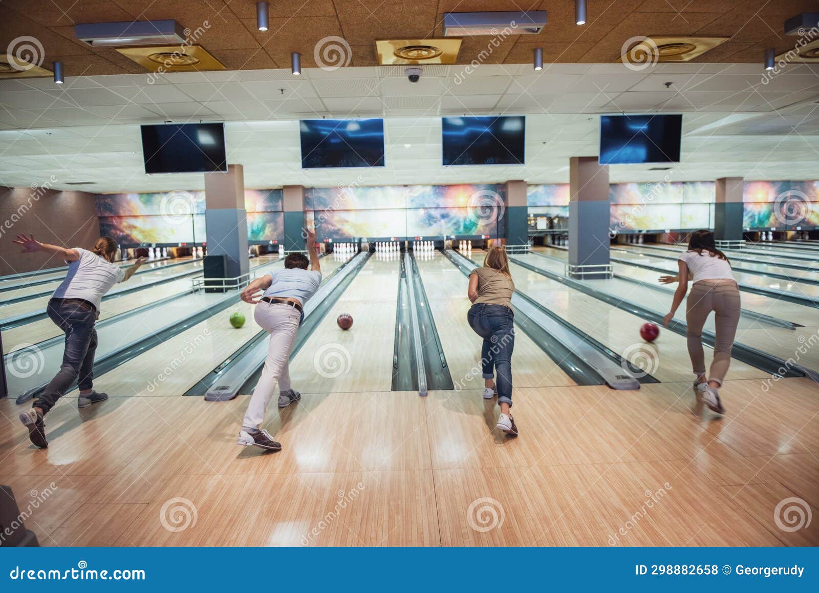 Friends playing bowling stock photo. Image of laugh - 298882658