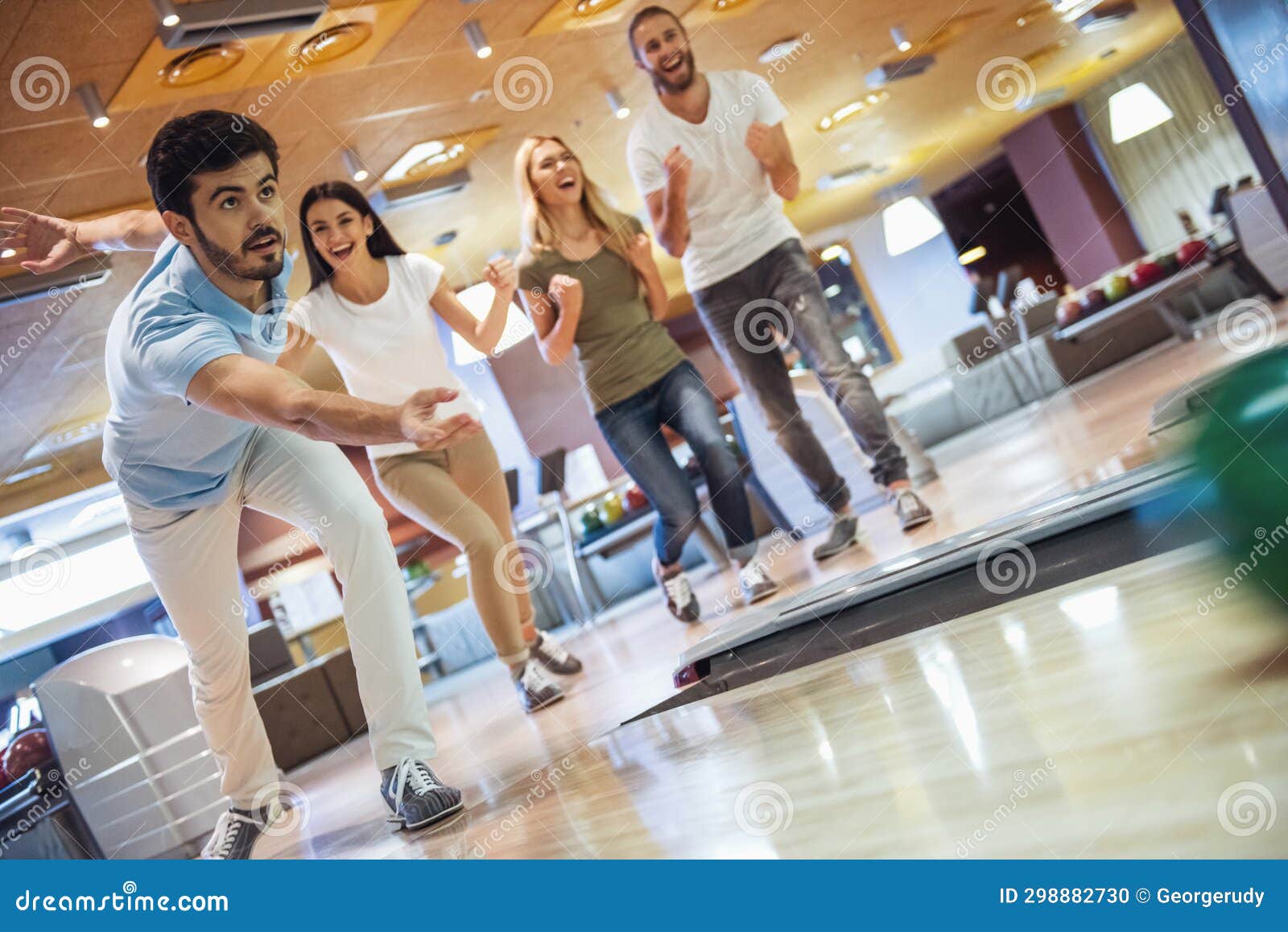 Friends playing bowling stock photo. Image of alley - 298882730