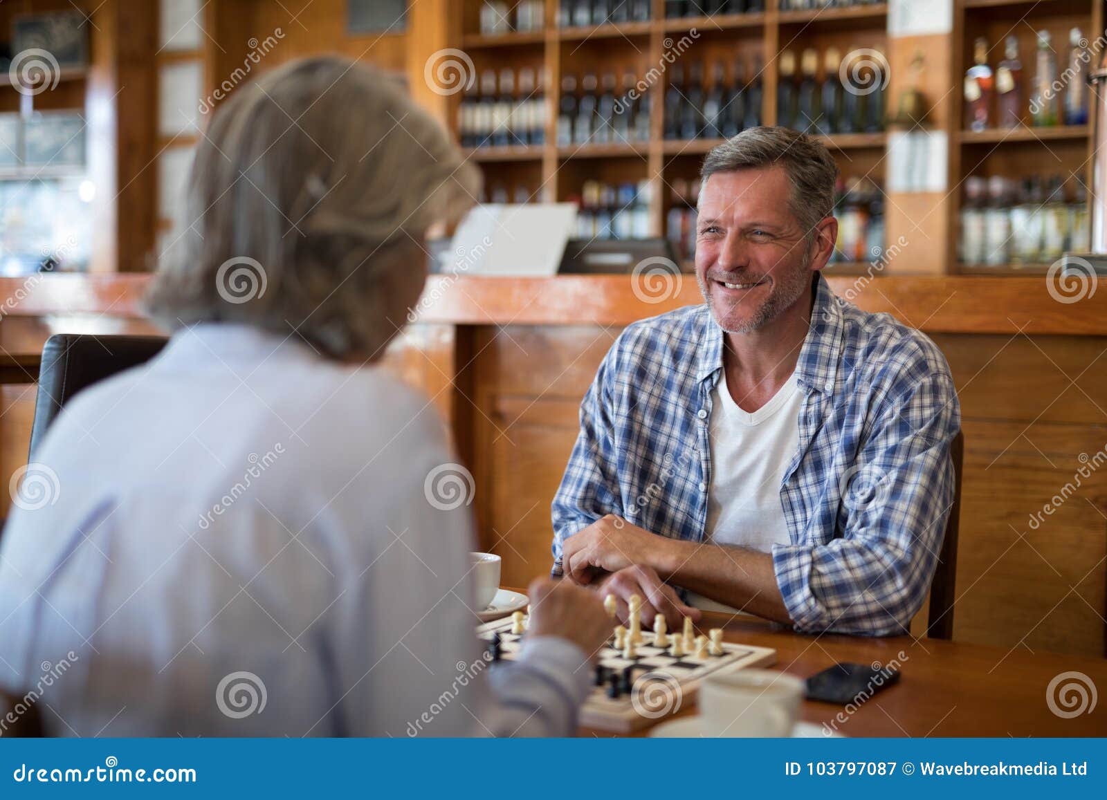 Friends Playing Chess in Bar Stock Image - Image of coffee ...