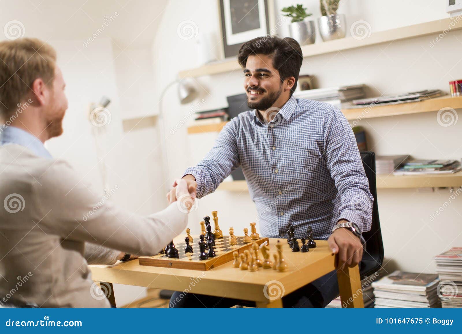 Friends playing chess stock image. Image of young, playing - 101647675
