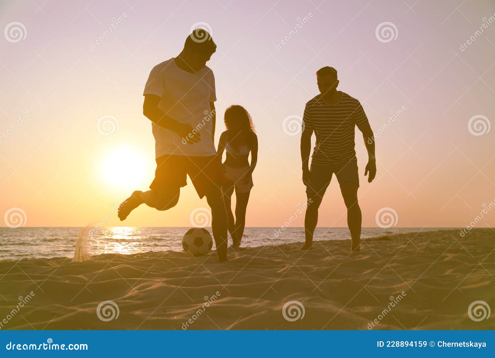 Friends Playing Football on Beach at Sunset Stock Image - Image of ...