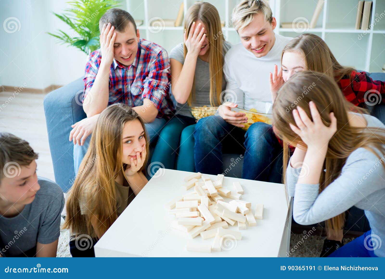 Friends playing jenga stock image. Image of young, concentrated - 90365191