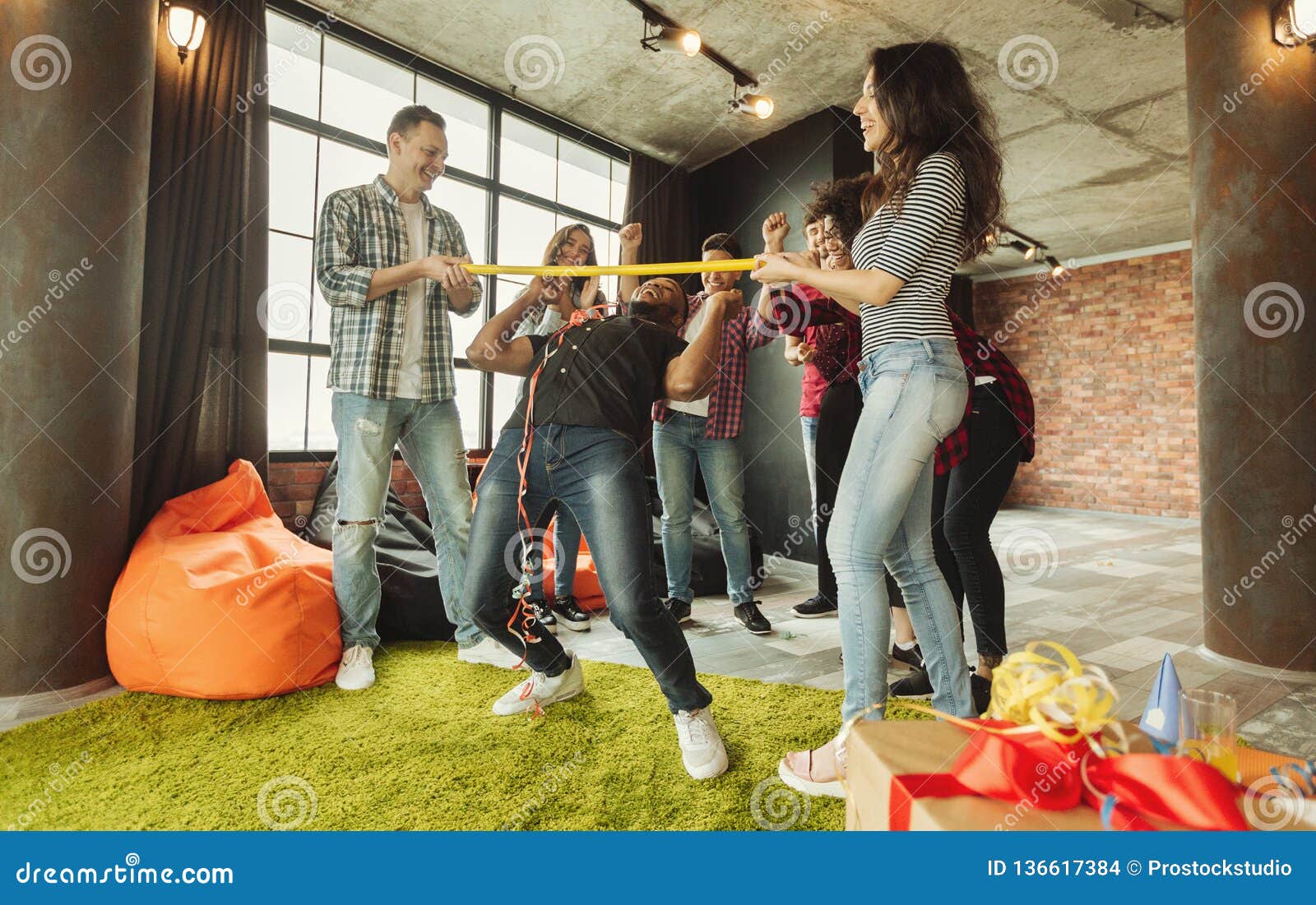 Friends playing limbo stock photo. Image of game, female - 136617384