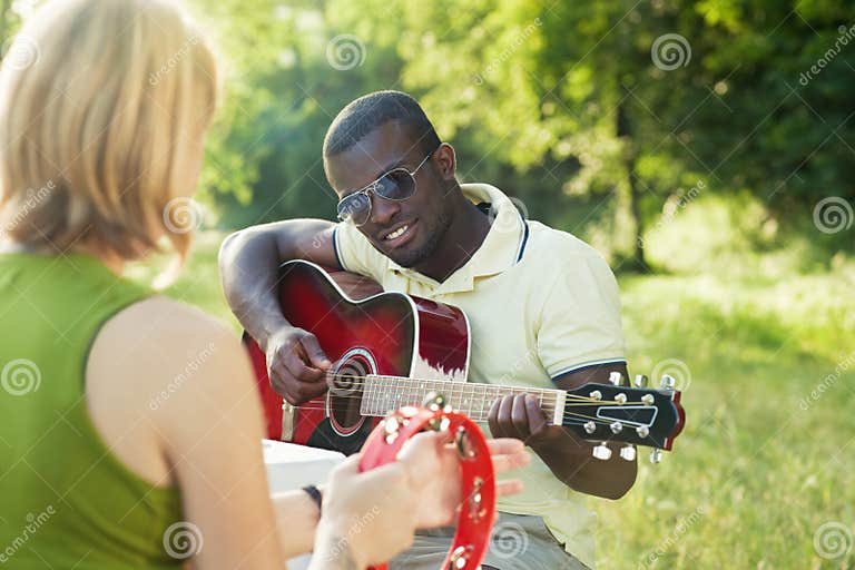 Friends playing music stock photo. Image of amusement - 9563298