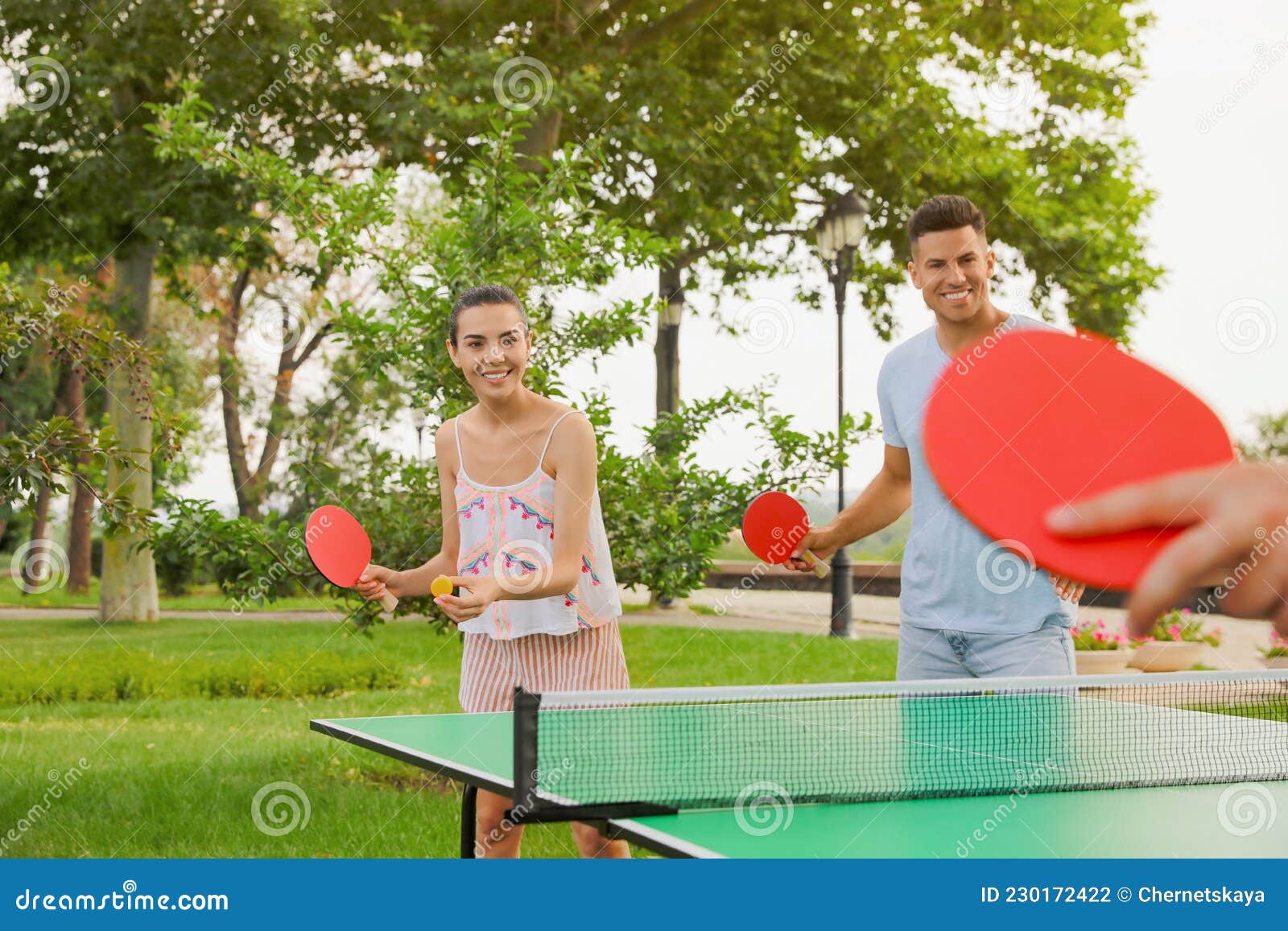 Friends Playing Ping Pong Outdoors on Summer Day Stock Photo - Image of ...