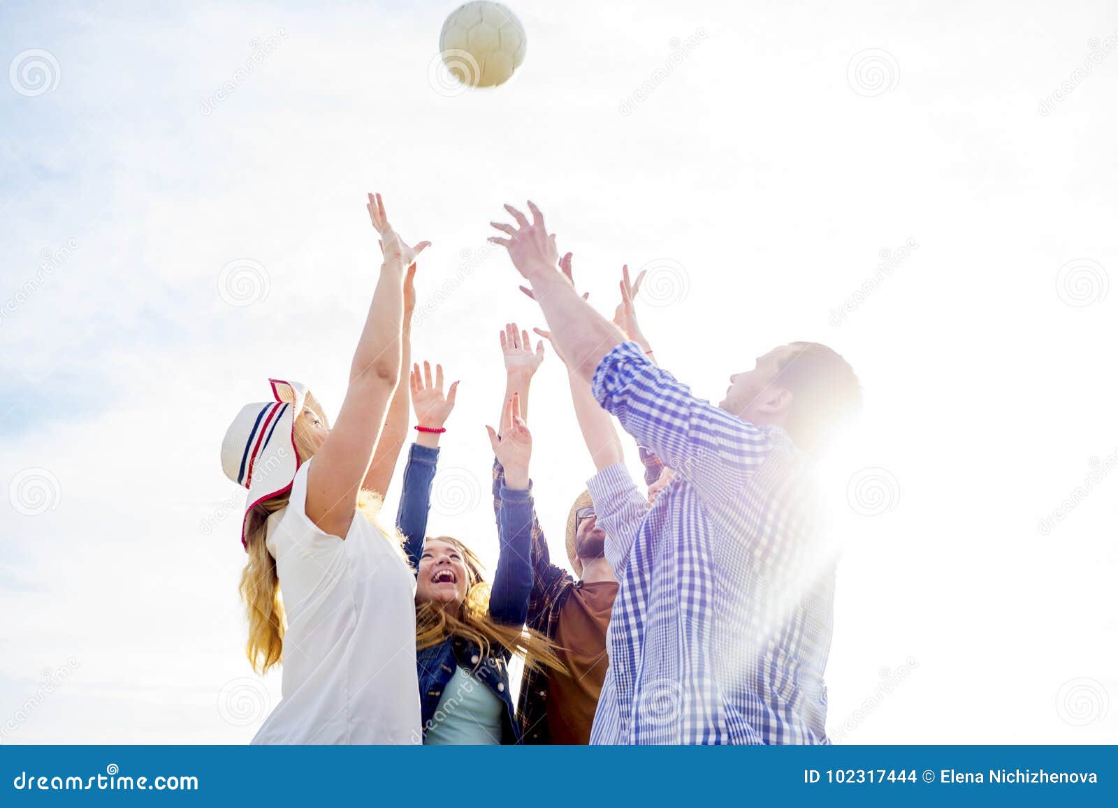 Friends playing volleyball stock photo. Image of sand - 102317444