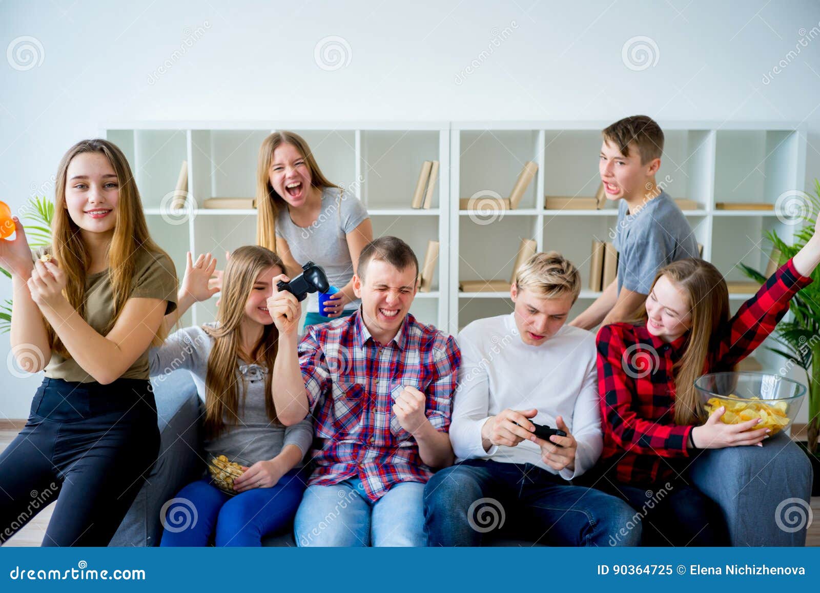 Friends playing an xbox stock image. Image of nintendo - 90364725