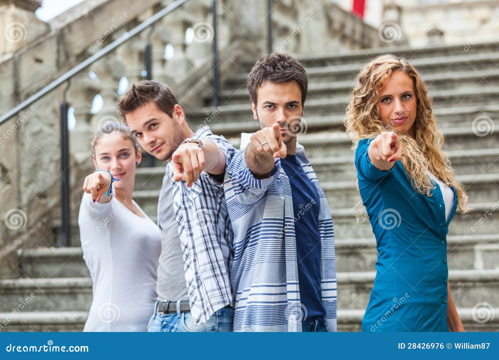 Friends pointing at Camera stock photo. Image of posing - 28426976
