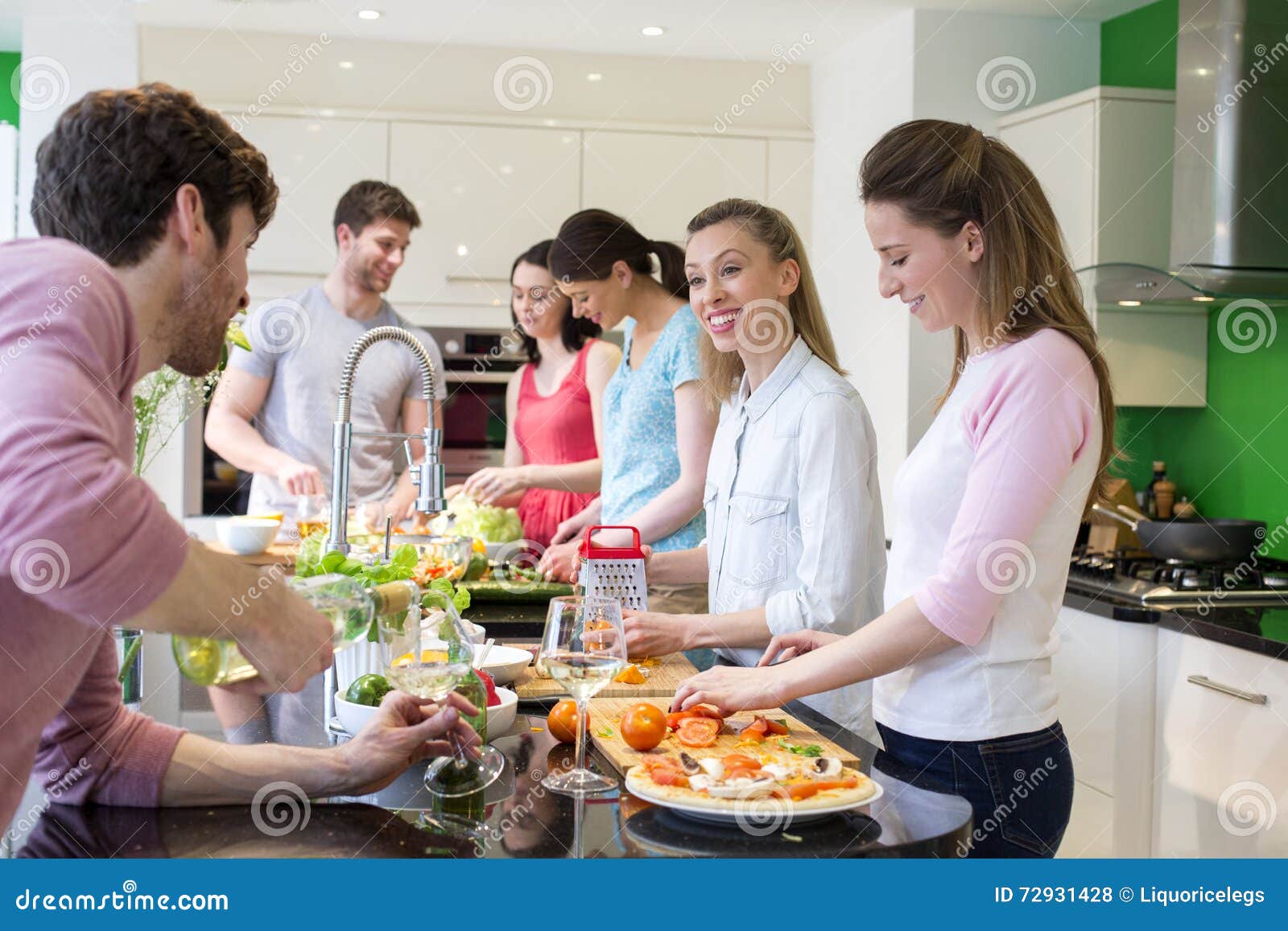 Friends Preparing a Meal stock photo. Image of evening - 72931428