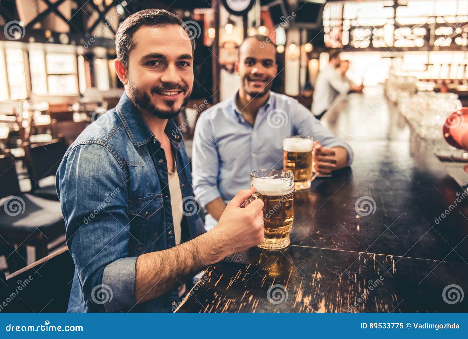 Friends in pub stock image. Image of friendship, alcohol - 89533775