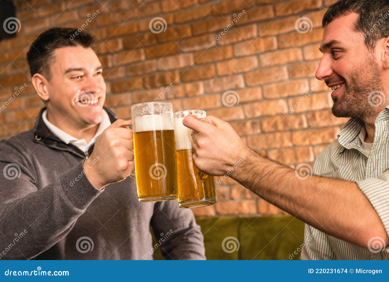 Friends in pub stock photo. Image of enjoyment, bonding - 220231674