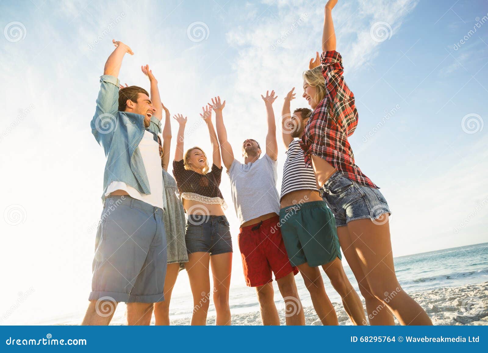 Friends raising their arms stock photo. Image of fondness - 68295764
