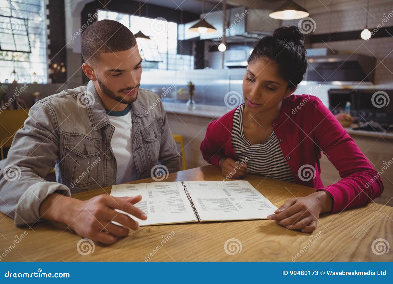 Friends Reading Menu in Cafe Stock Image - Image of front, mixedrace ...