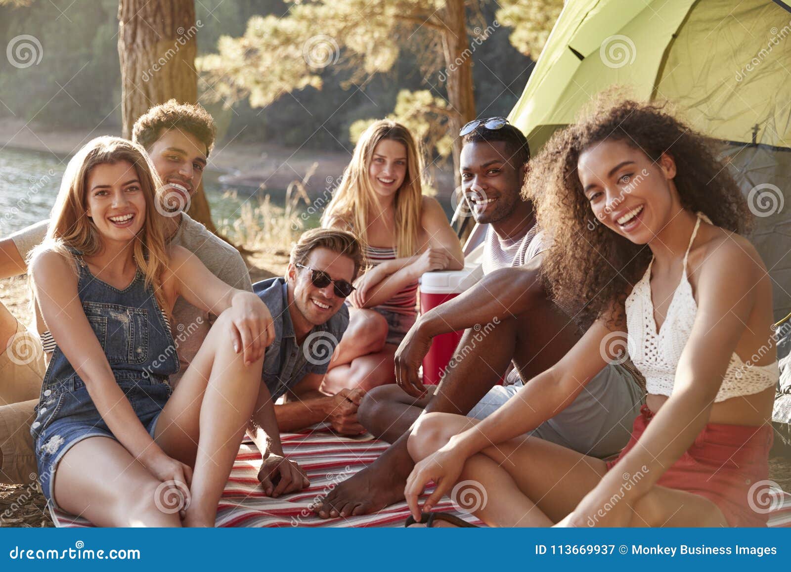 Friends Relaxing on a Blanket by a Lake, Close Up Stock Image - Image ...