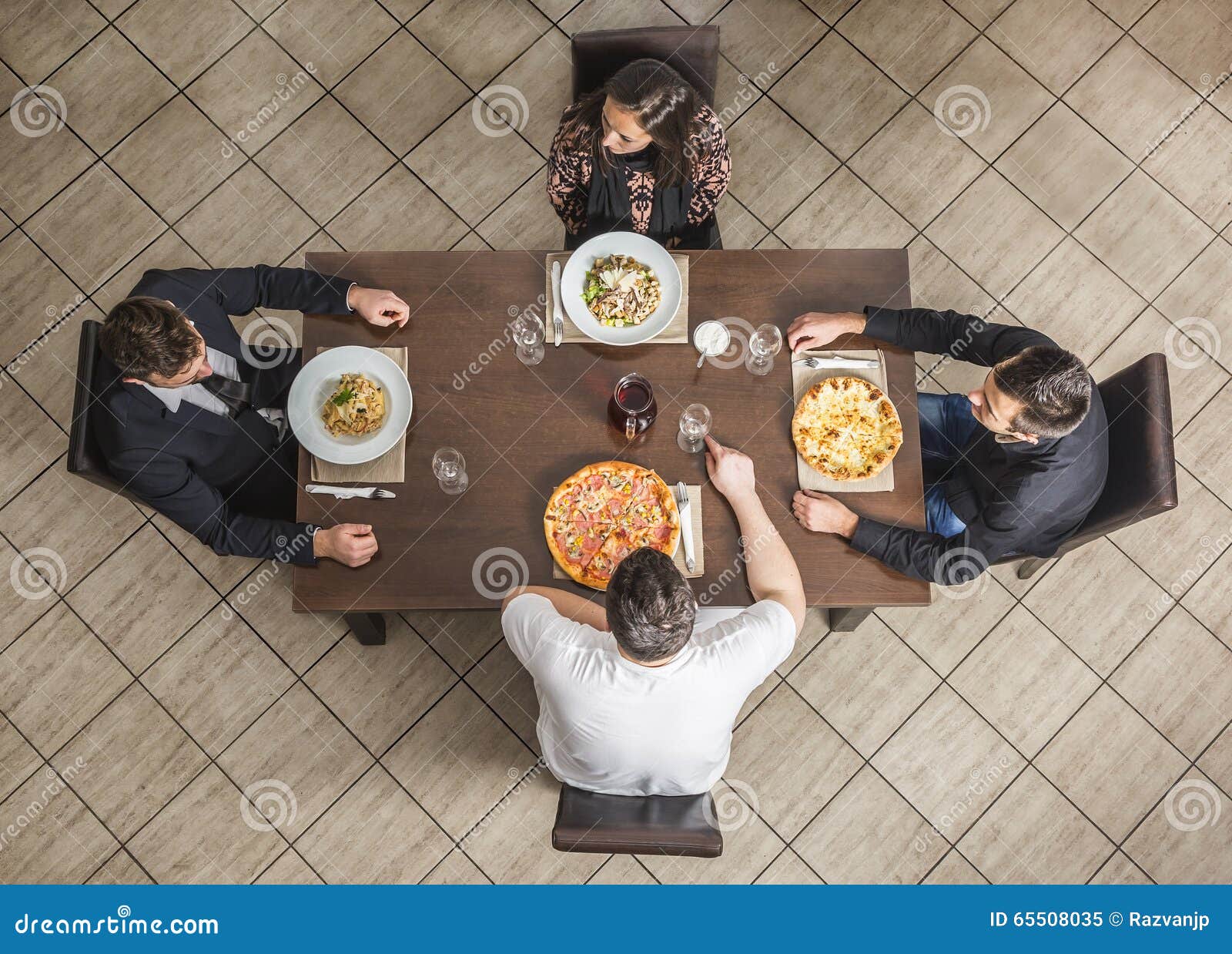Friends at a Restaurant stock image. Image of plates - 65508035