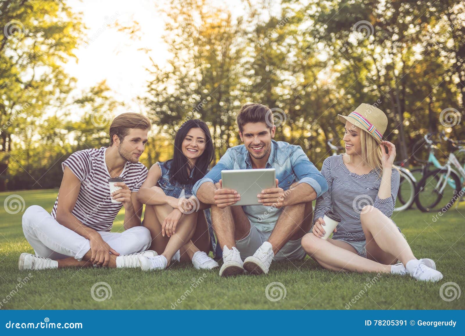 Friends resting in park stock image. Image of couple - 78205391