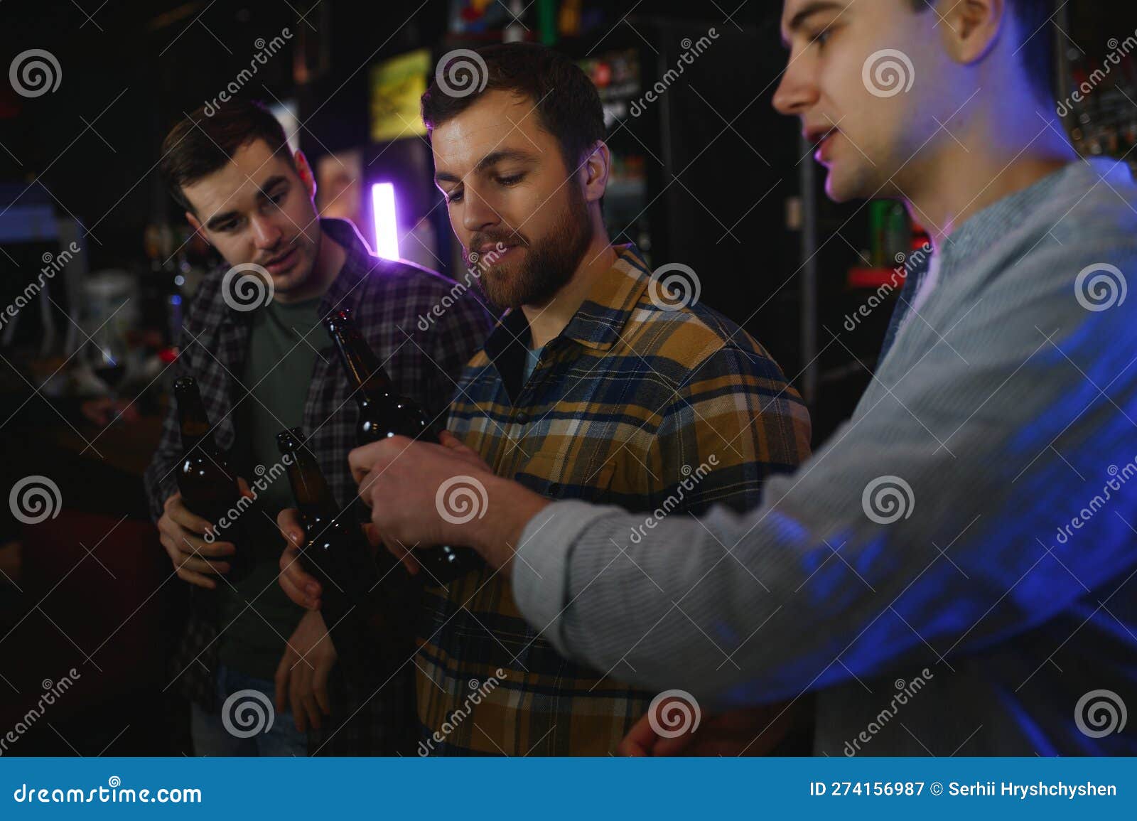 Friends Resting in the Pub with Beer in Hands. Having Conversation ...