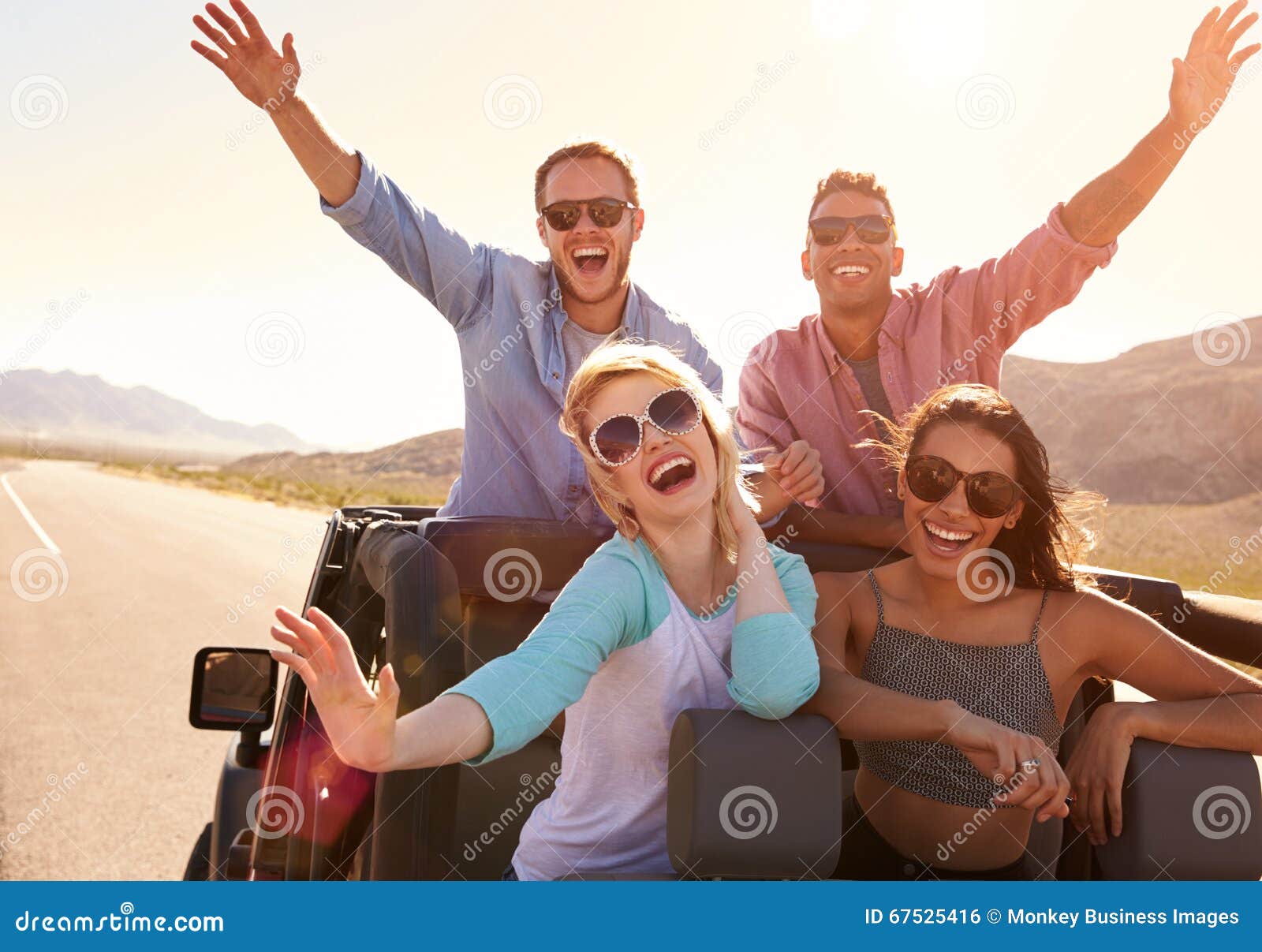Friends on Road Trip Standing in Convertible Car Stock Photo - Image of ...