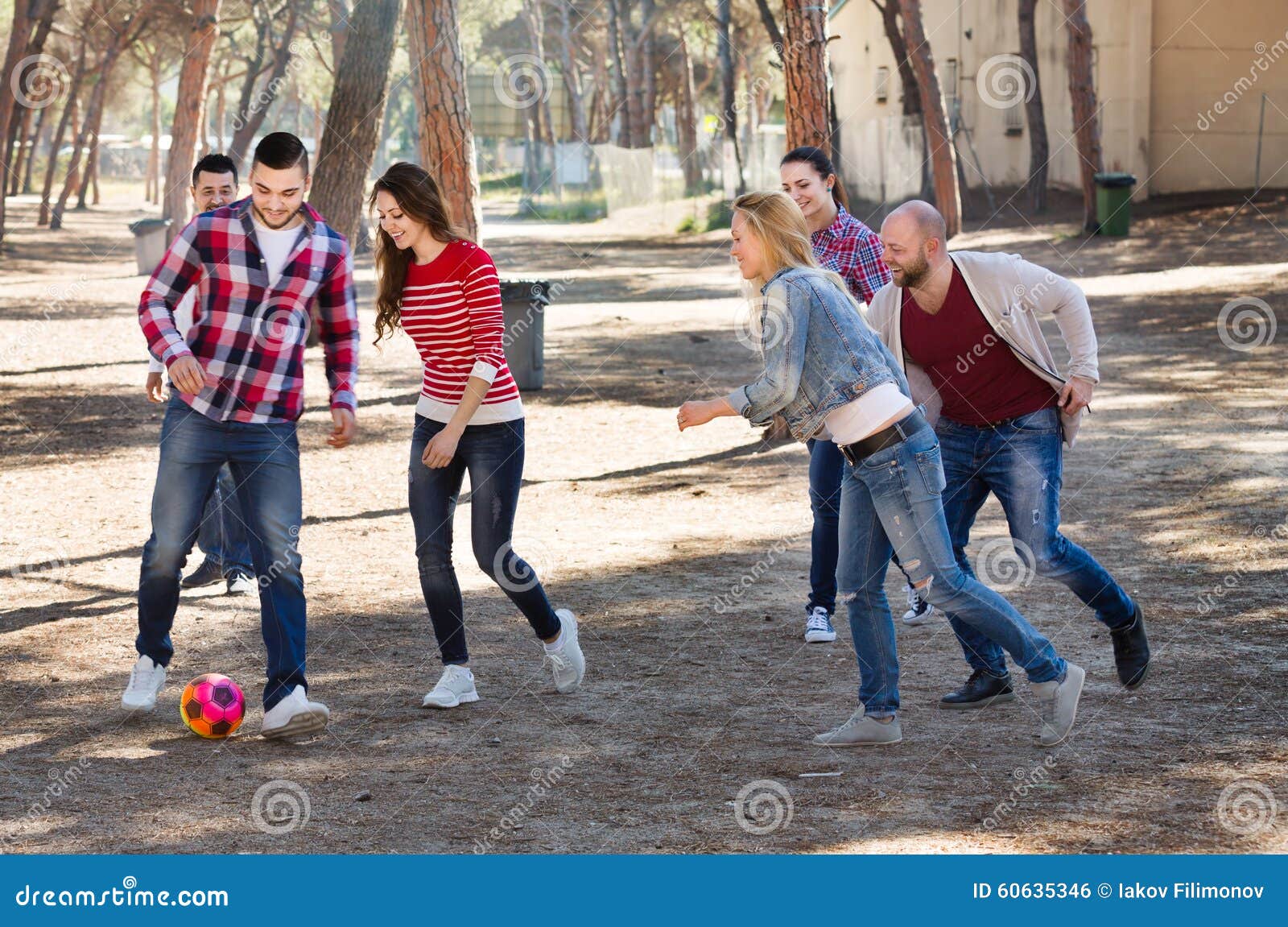Friends running with ball stock photo. Image of male - 60635346