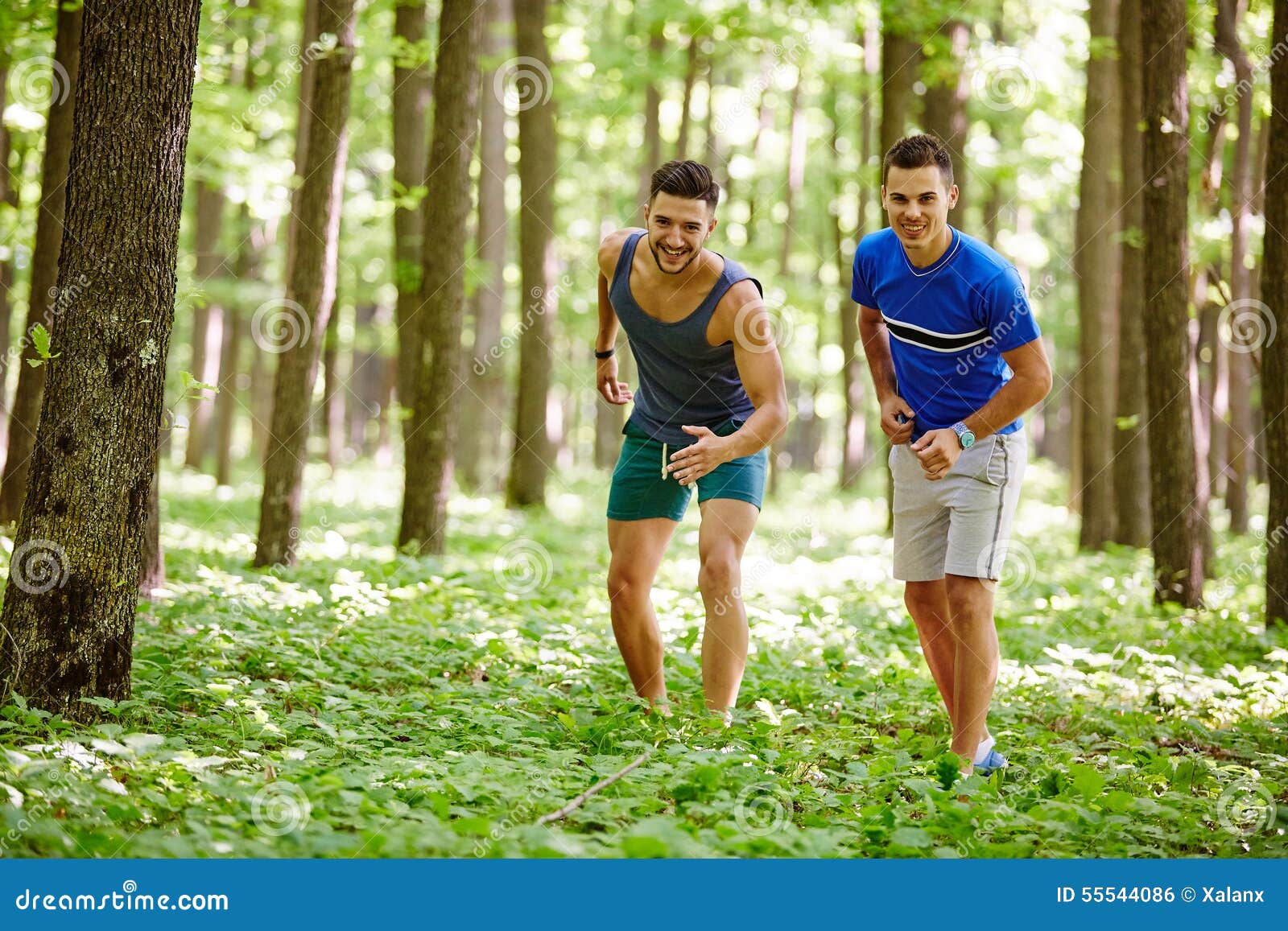 Friends Running through Forest Stock Photo - Image of health, people ...