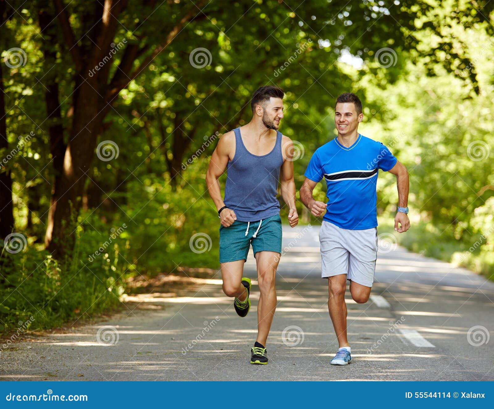 Friends Running through Forest Stock Photo - Image of athlete, adult ...