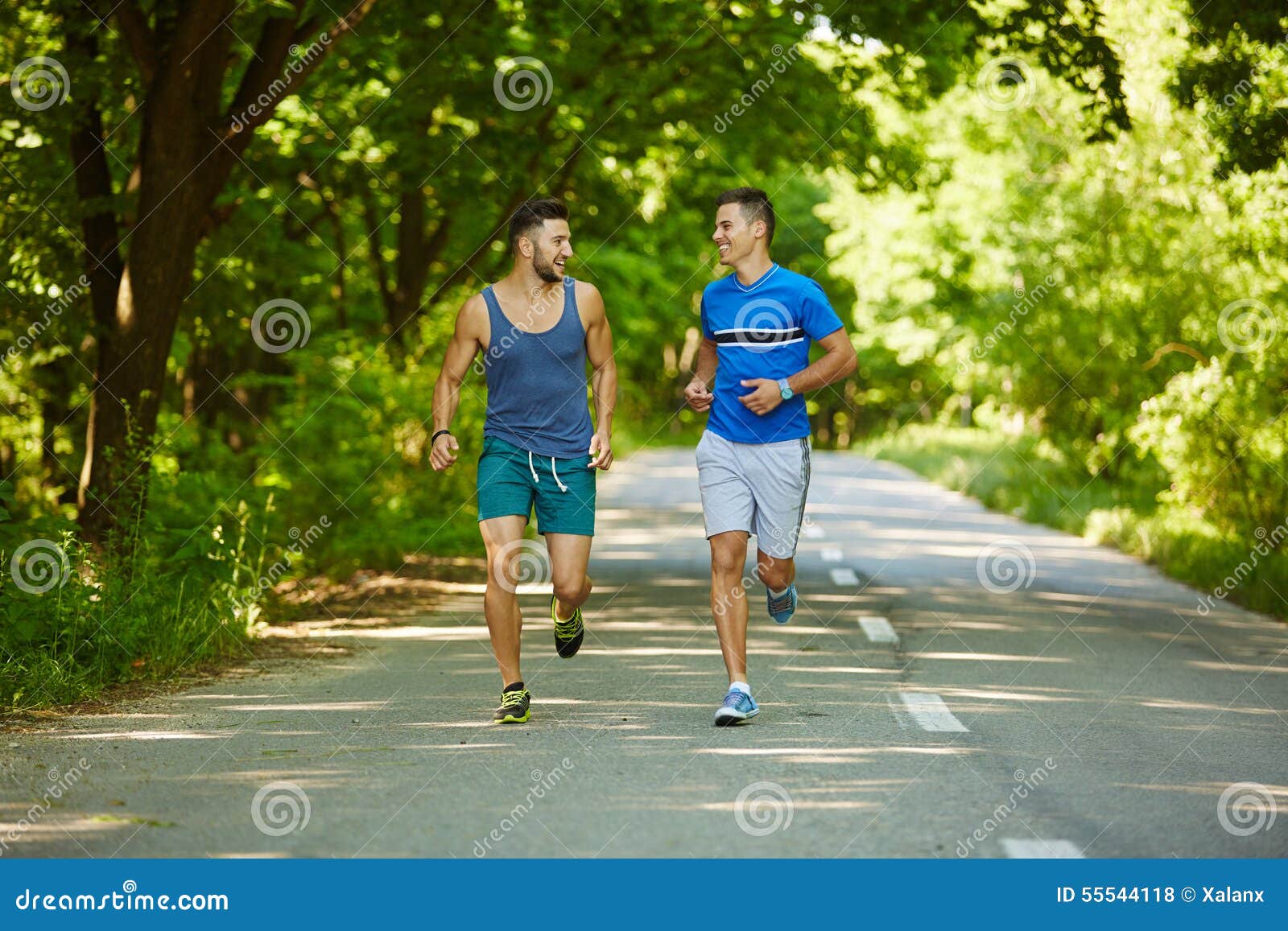 Friends Running through Forest Stock Photo - Image of male, active ...