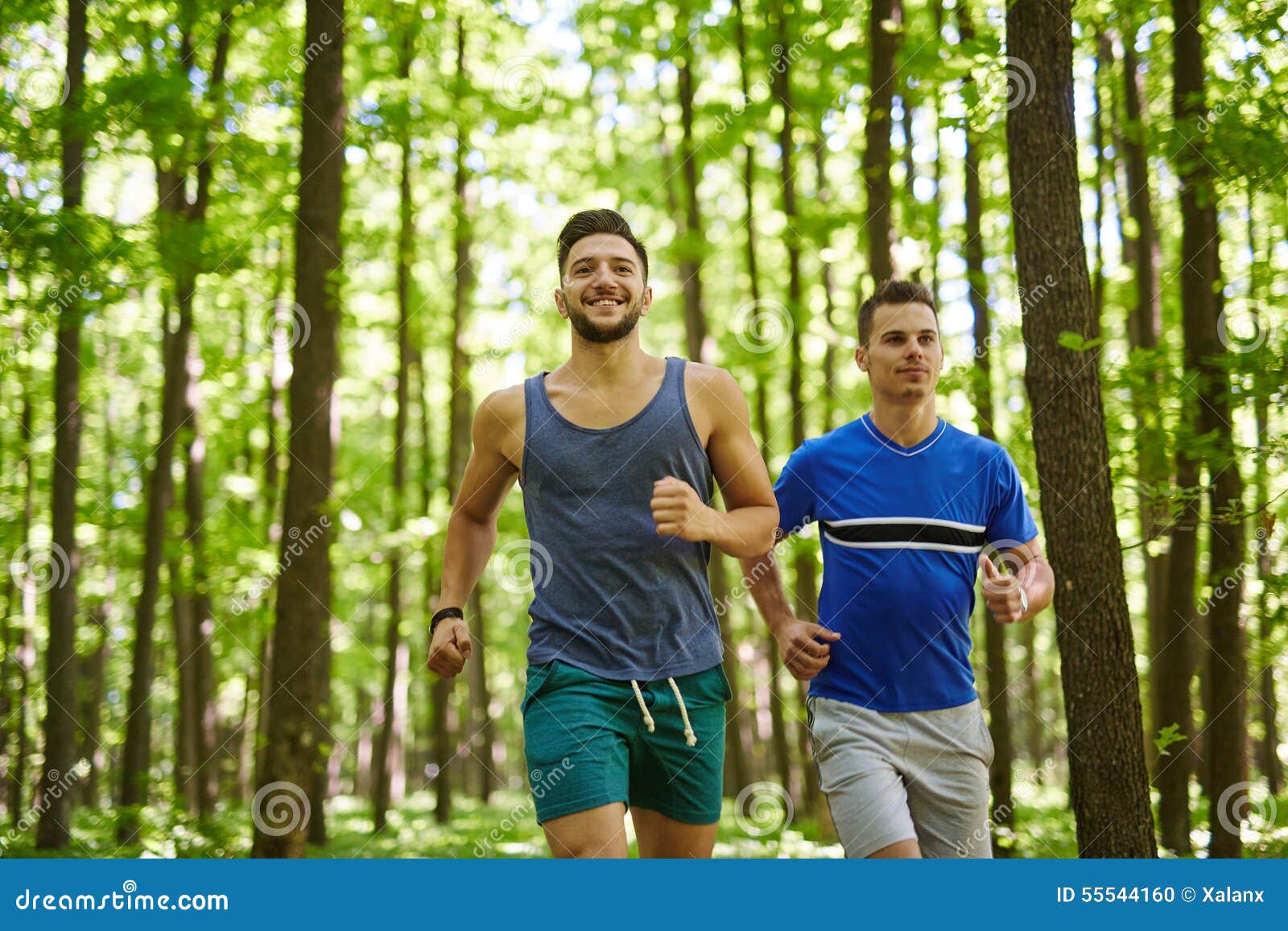Friends Running through Forest Stock Photo - Image of activity, fast ...
