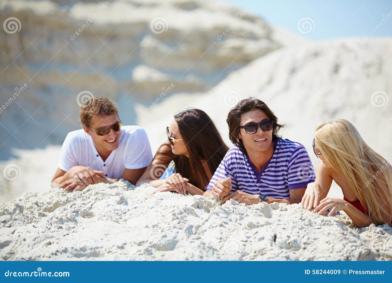 Friends on sand stock image. Image of group, adults, outdoors - 58244009