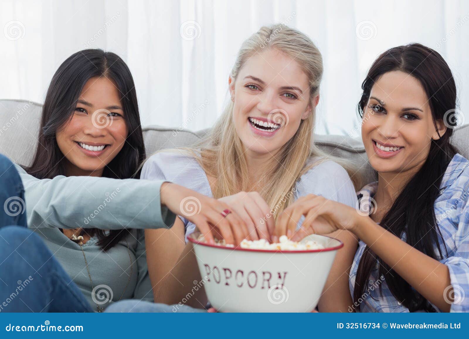 Friends Sharing Bowl of Popcorn and Watching Tv Stock Photo - Image of ...