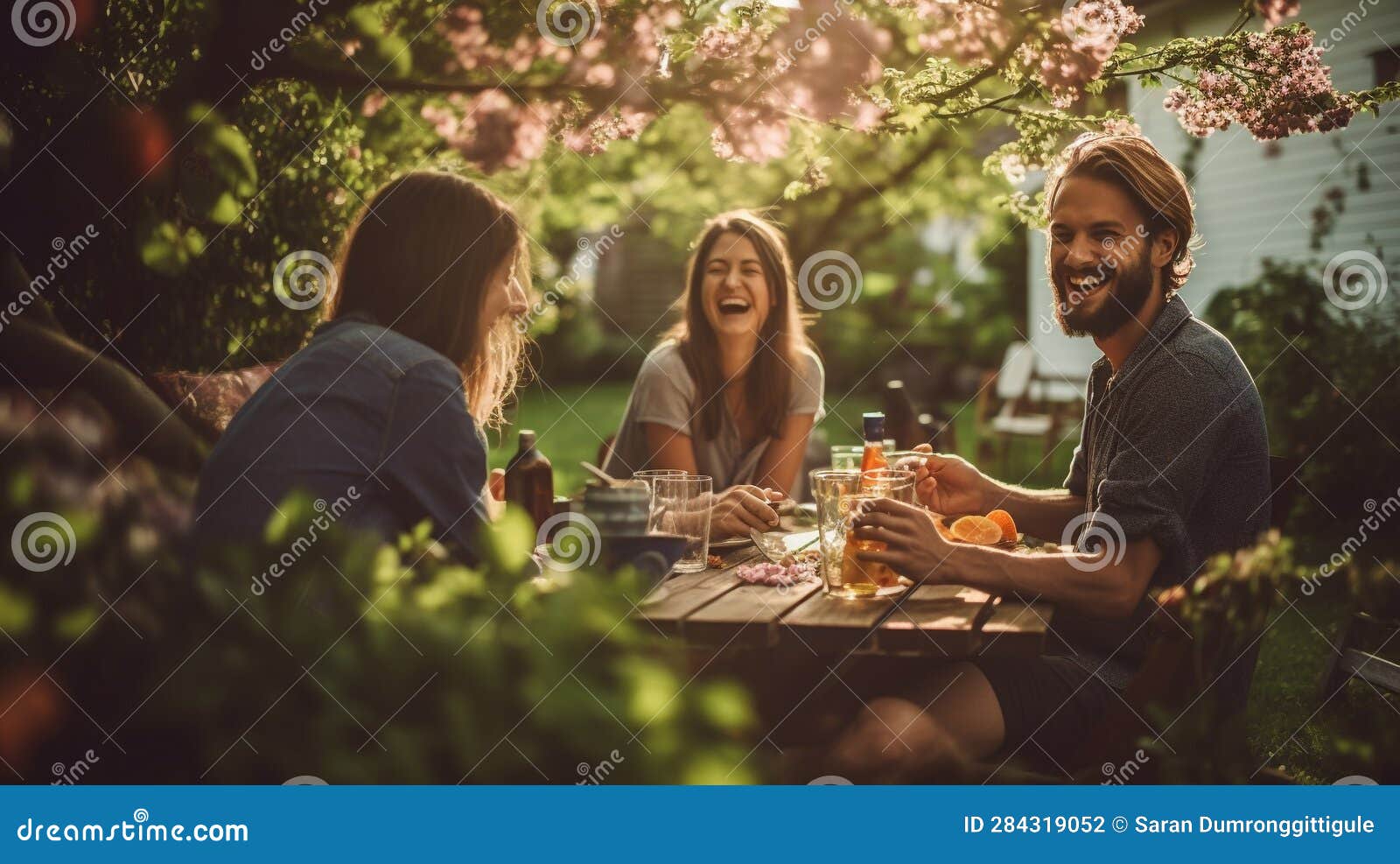 Friends Sharing Laughter and Meals Under the Canopy of Blossoming Trees ...