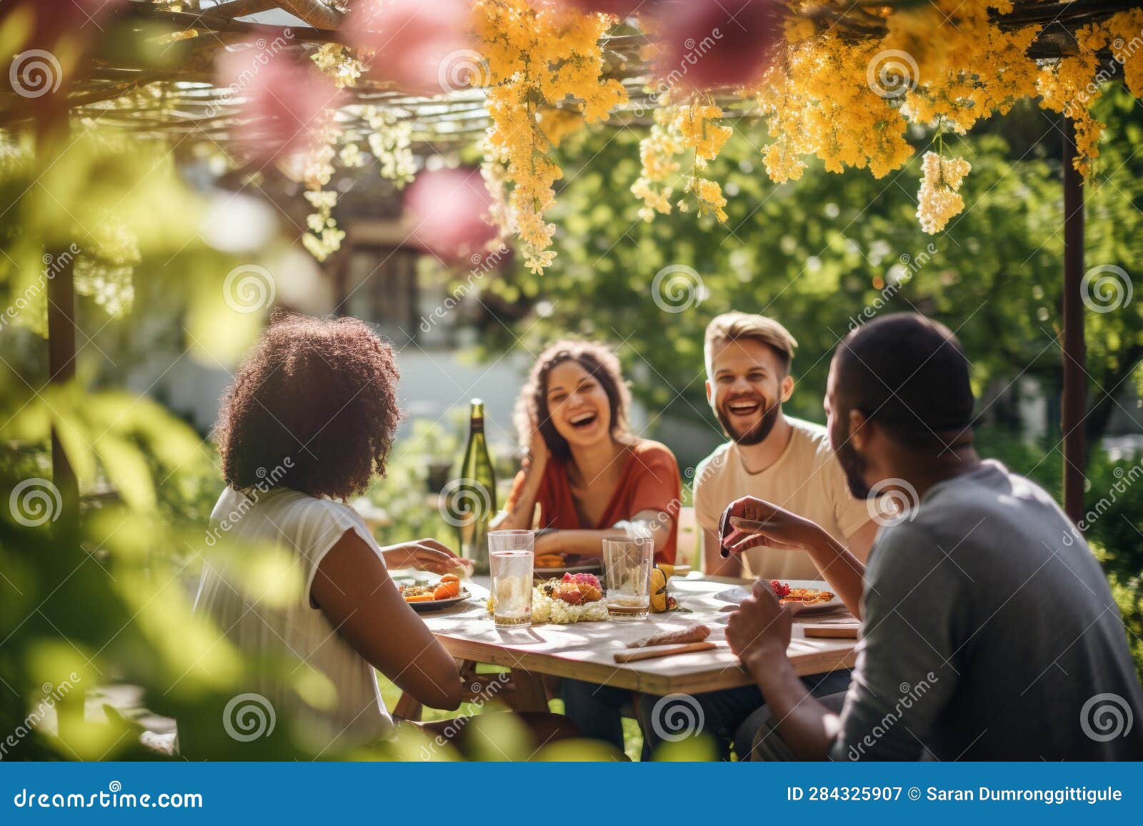 Friends Sharing Laughter and Meals Under the Canopy of Blossoming Trees ...