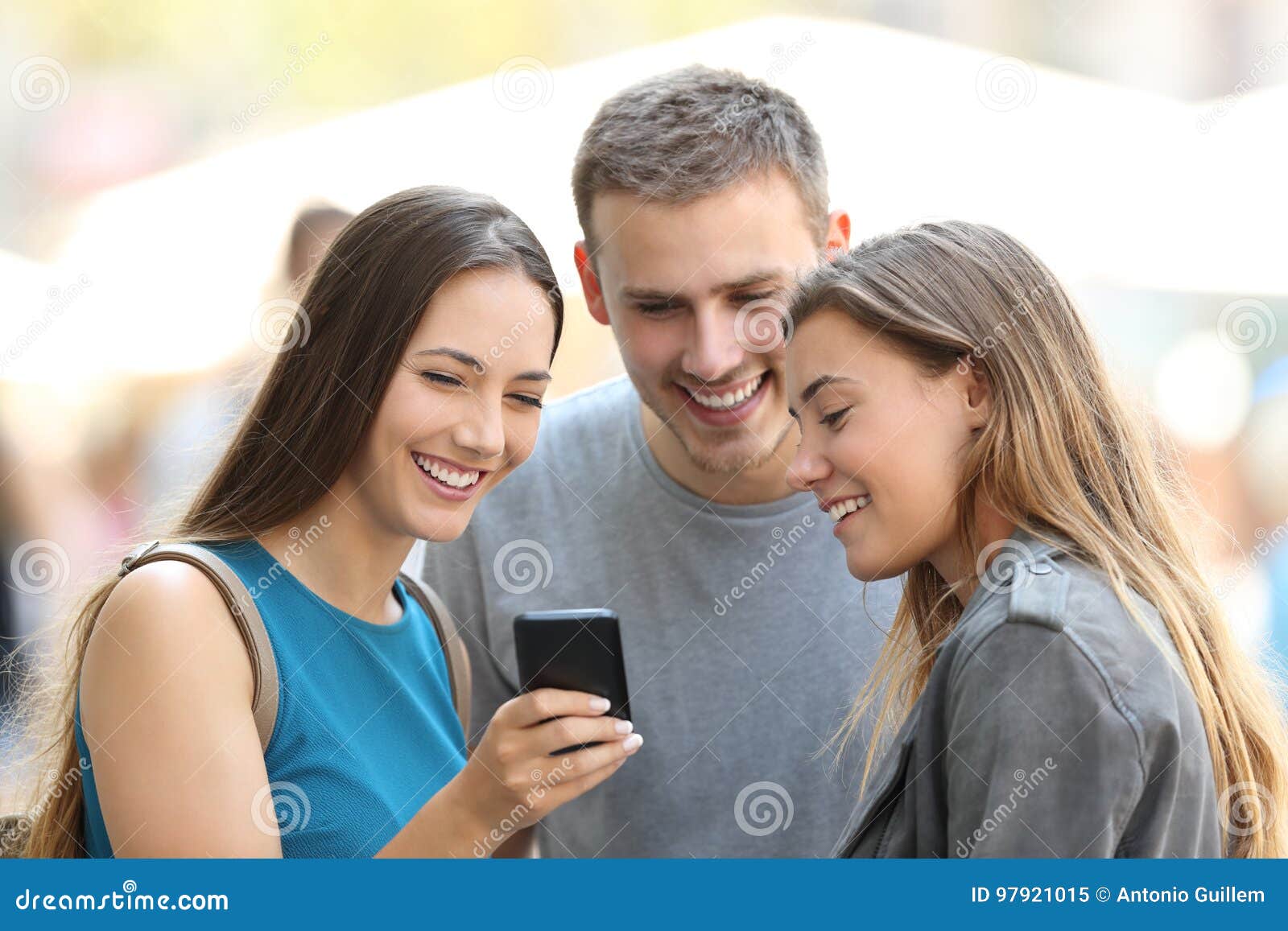 Friends Sharing Phone Content on the Street Stock Image - Image of ...