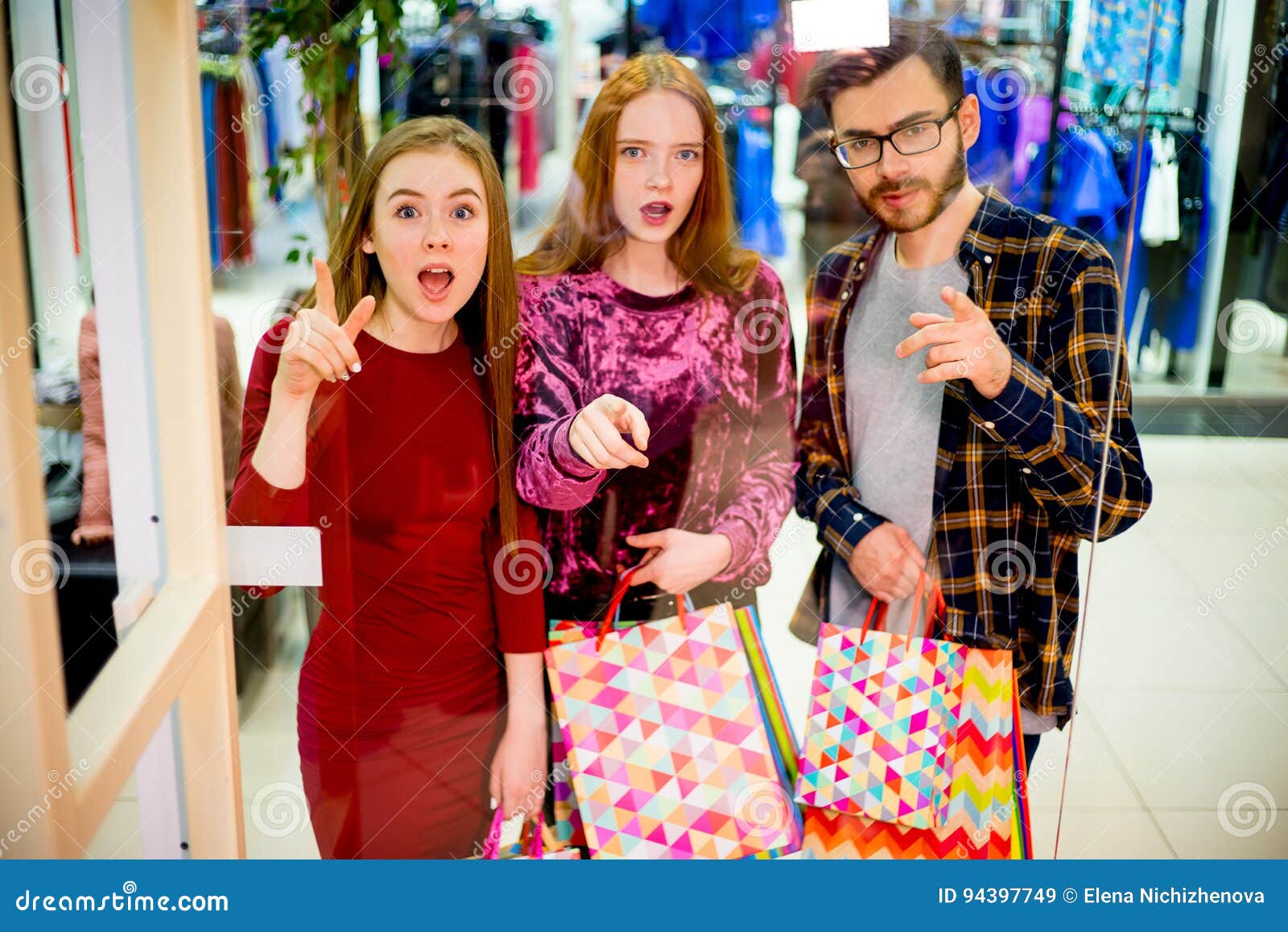 Friends shopping in mall stock image. Image of looking - 94397749